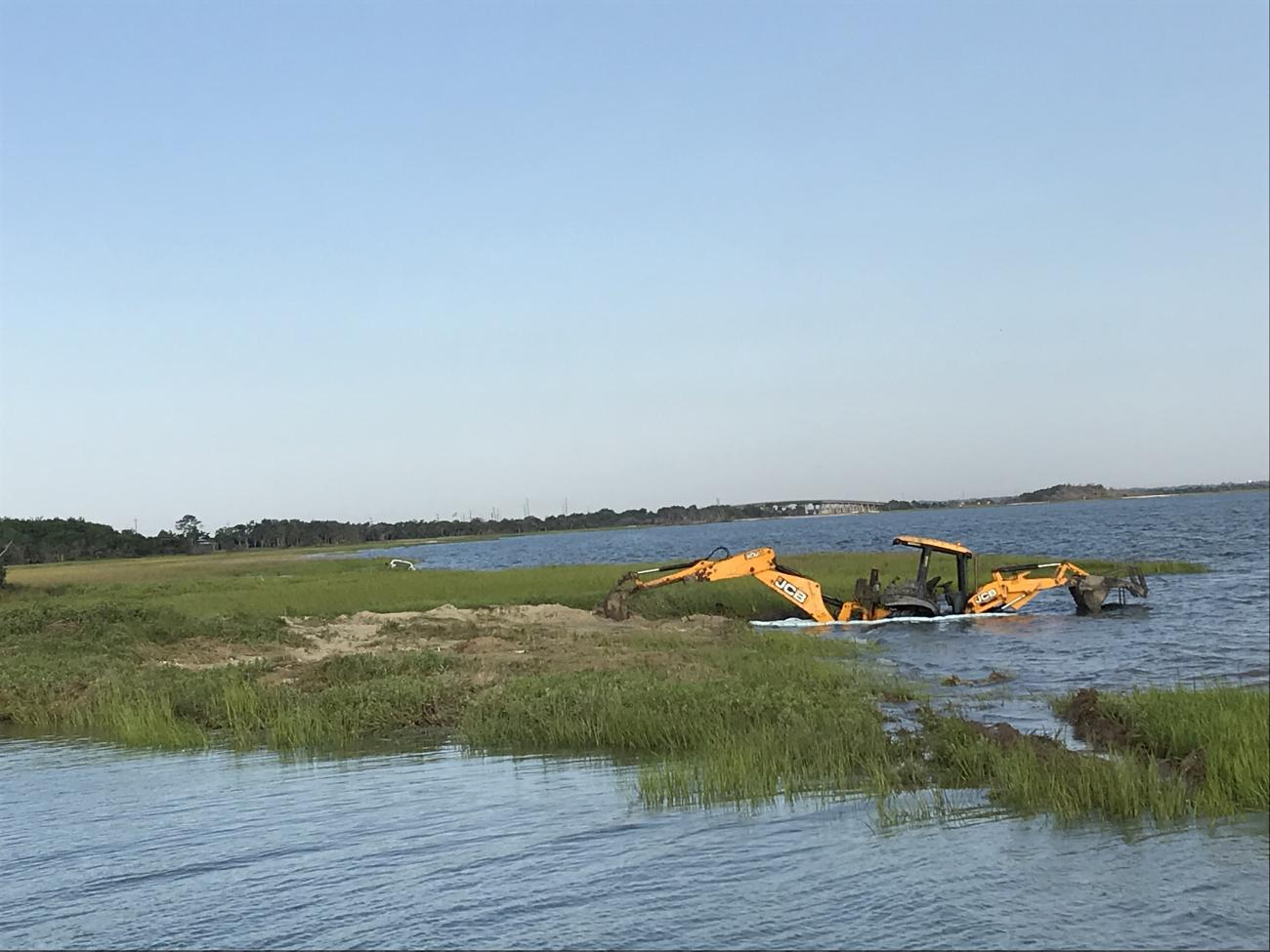 CRD investigating vehicles in Tybee Island marsh